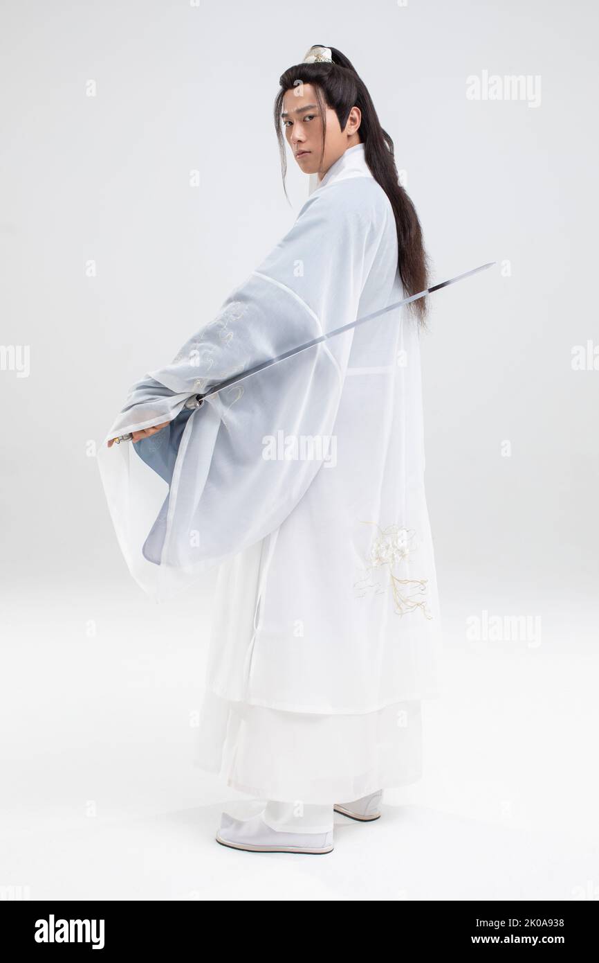 Young Chinese swordsman in ancient costume Stock Photo - Alamy