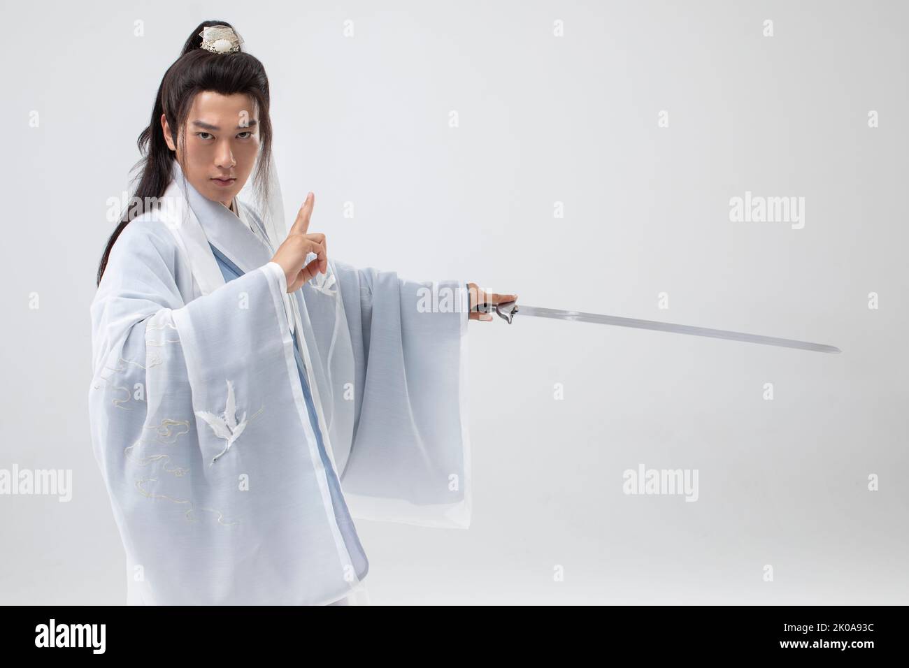 Young Chinese swordsman in ancient costume Stock Photo - Alamy