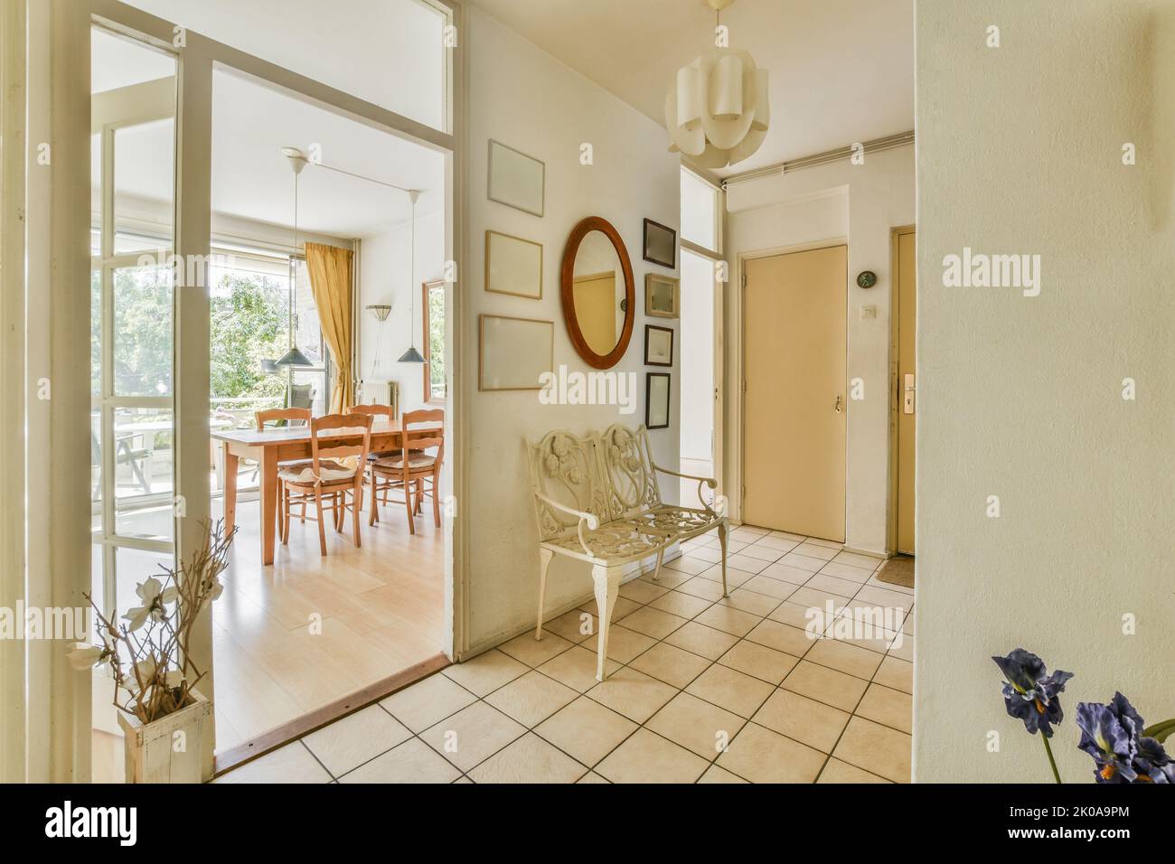 Stylish hallway with door and window to light dining room in modern ...