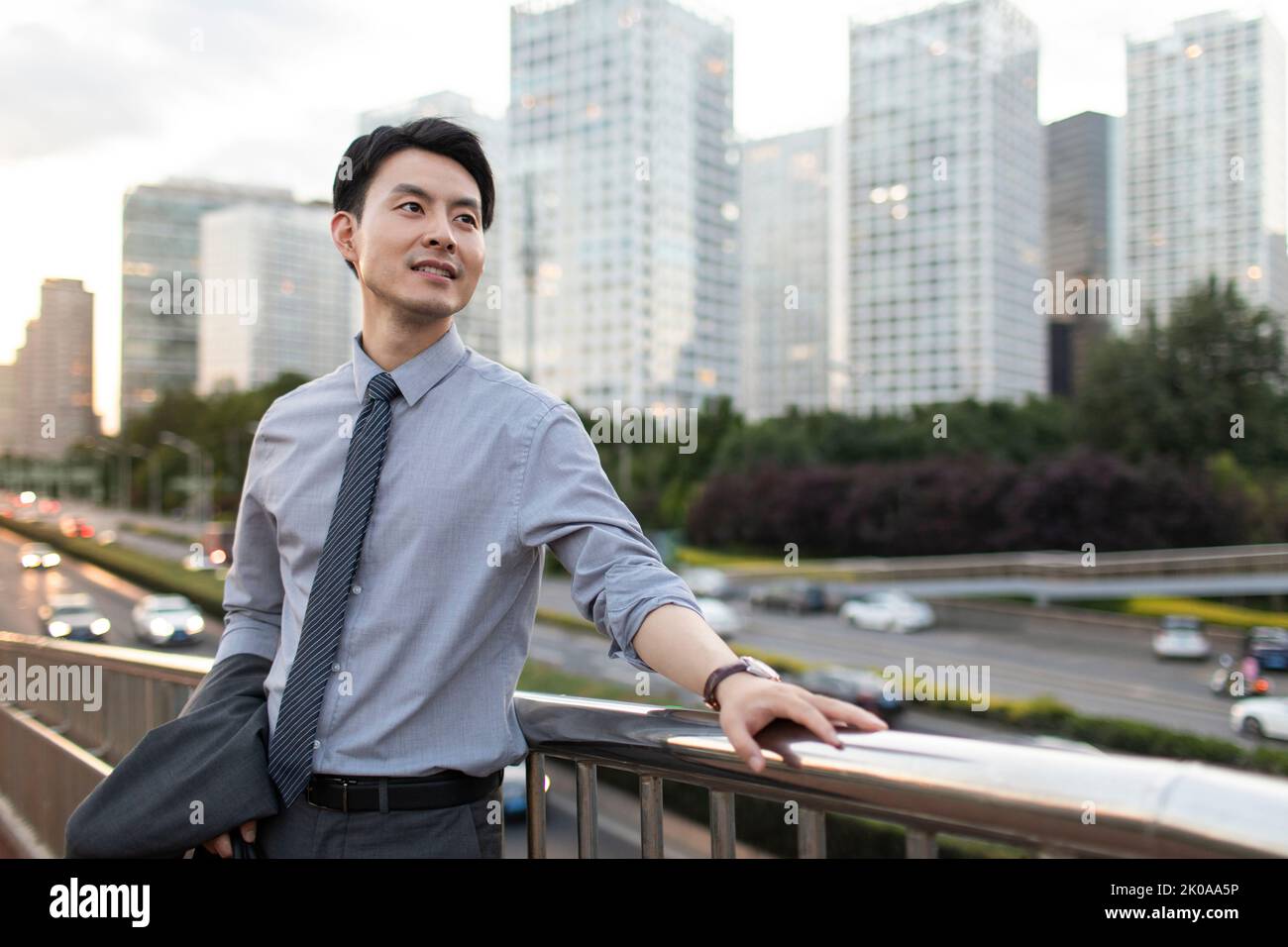 Confident Chinese businessman looking at view Stock Photo - Alamy