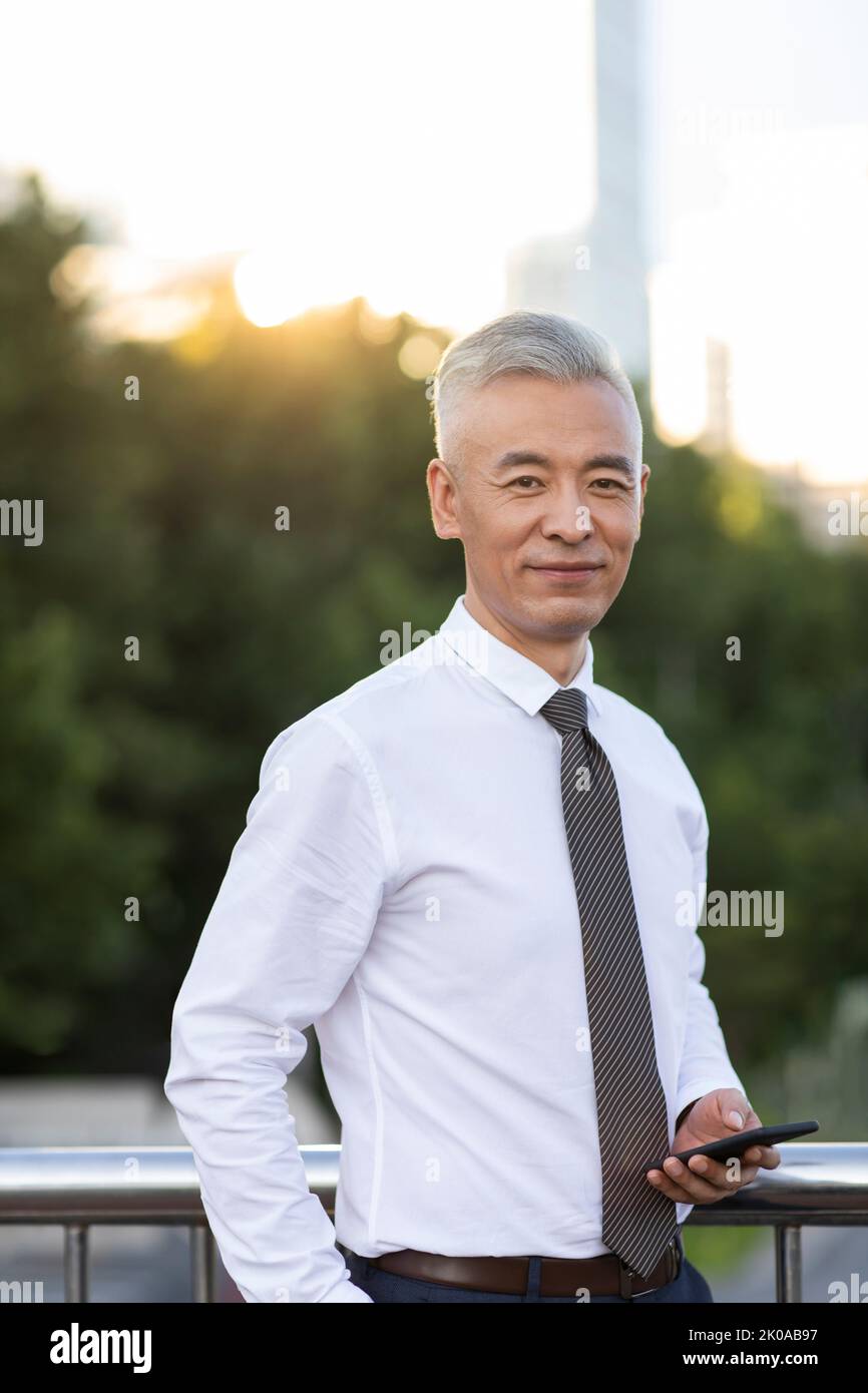 Portrait of confident Chinese businessman Stock Photo - Alamy