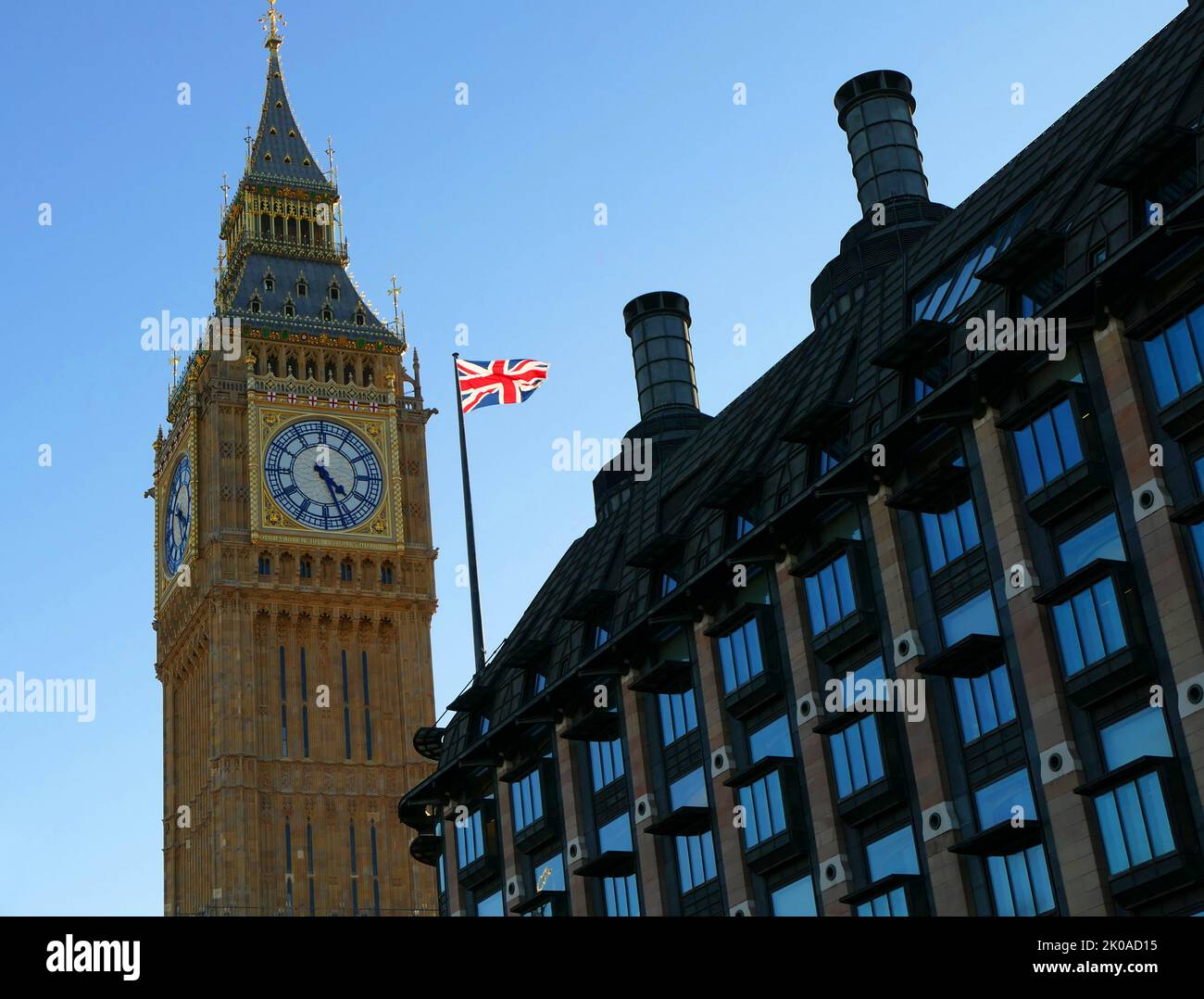 Big Ben rises above Portcullis House (offices of British Members of ...