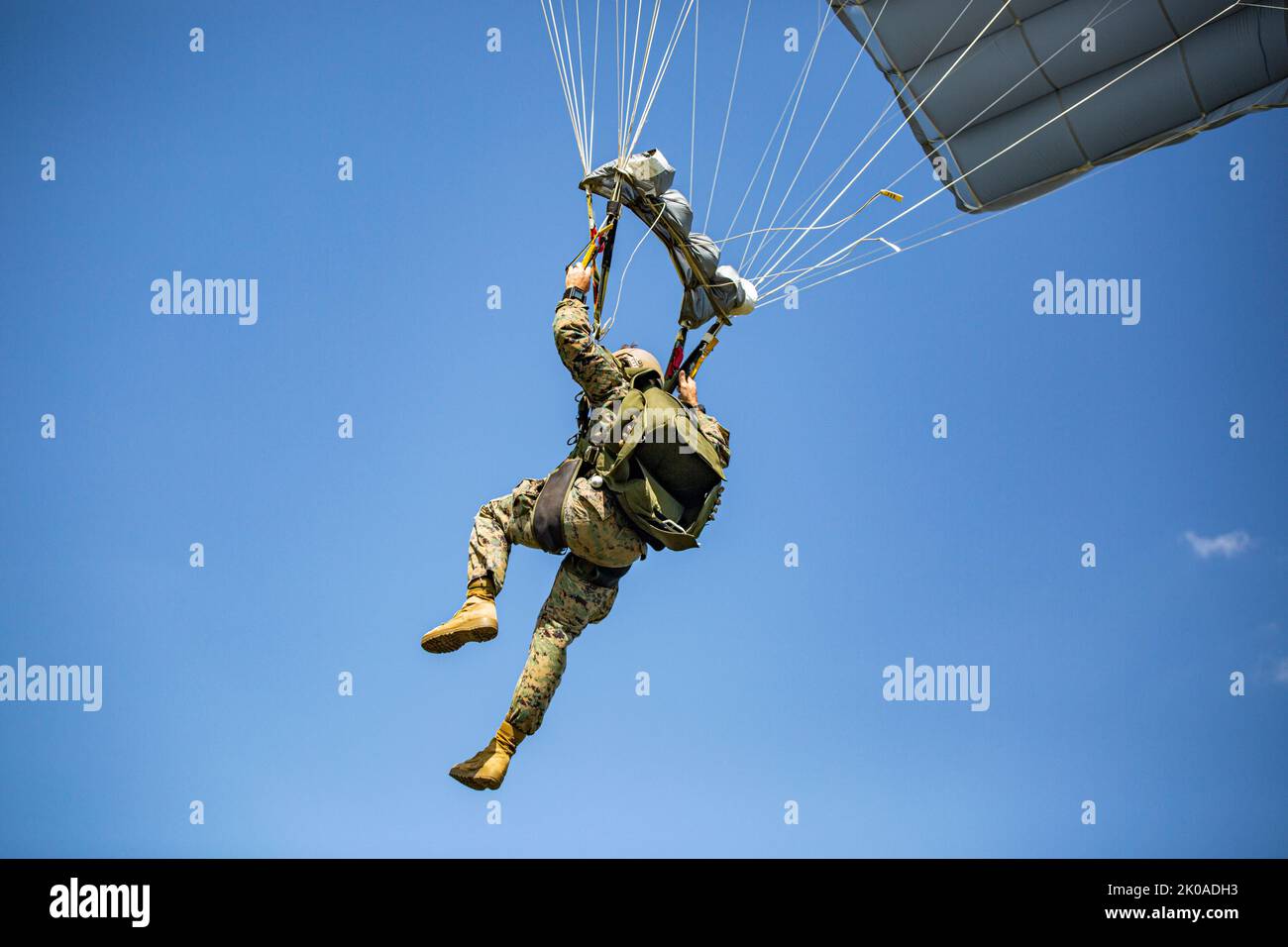 A U.S. Marine with 3rd Force Reconnaissance Battalion glides while ...