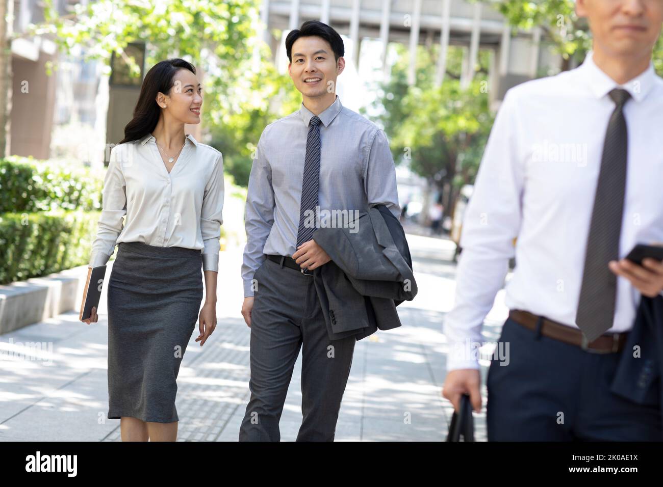 Chinese business people talking outdoors hi-res stock photography and ...