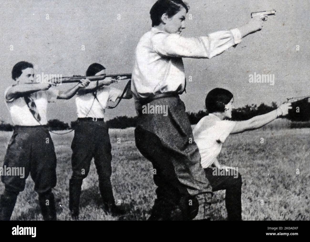 German women attending a schools of marksmanship where they are taught ...