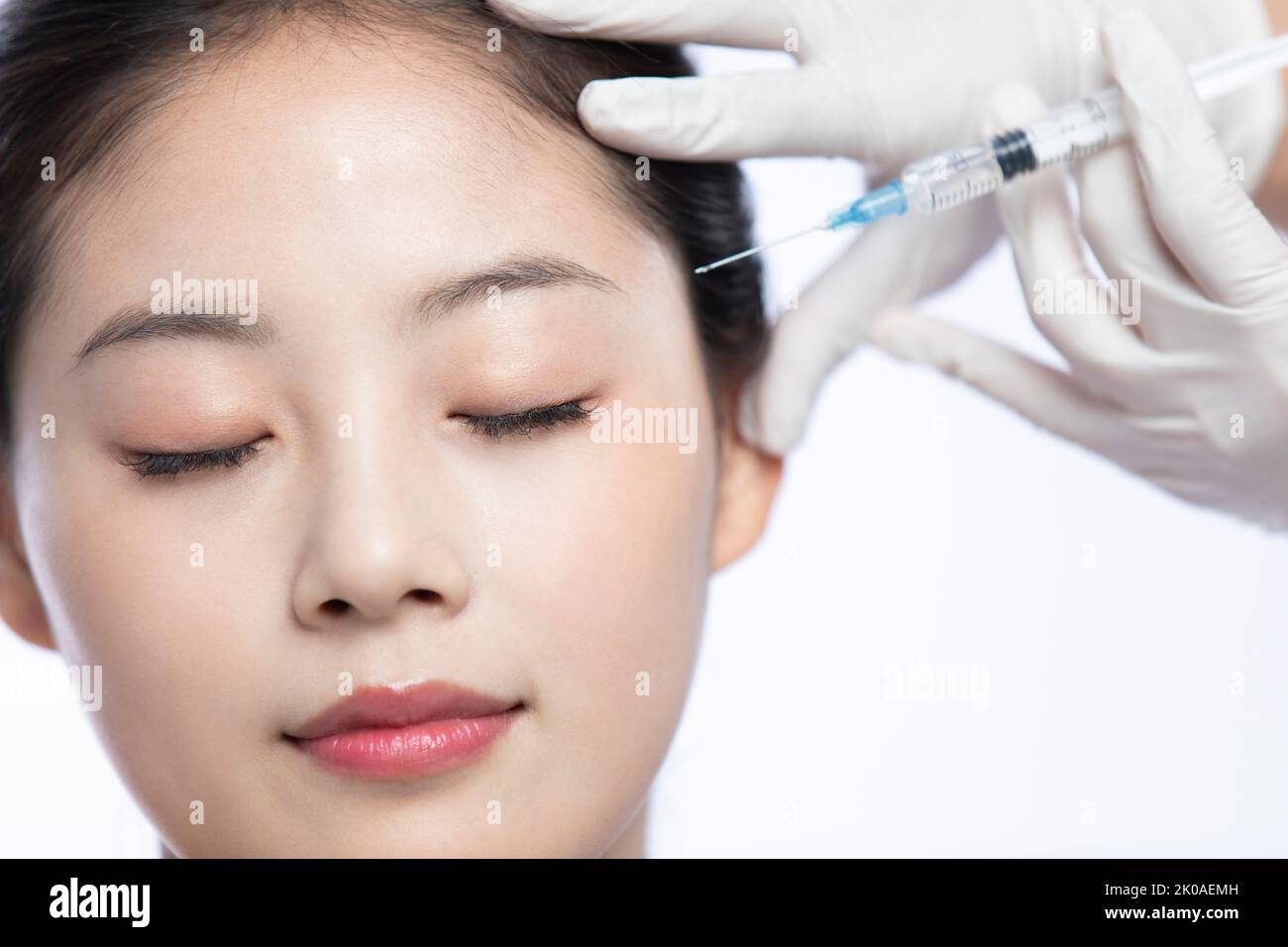 Chinese woman receiving botox injection hi-res stock photography and ...