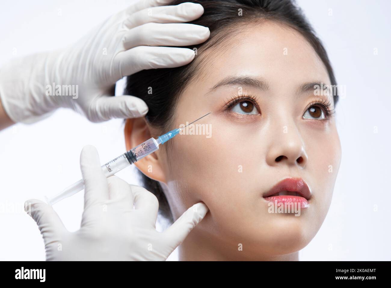 Young Chinese woman receiving Botox treatment Stock Photo - Alamy
