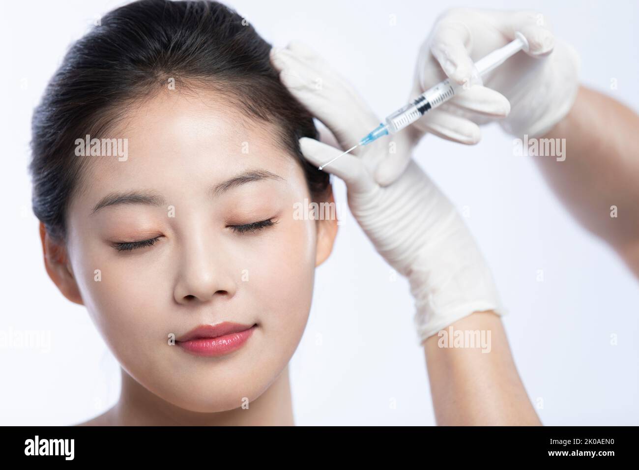 Chinese woman receiving botox injection hi-res stock photography and ...