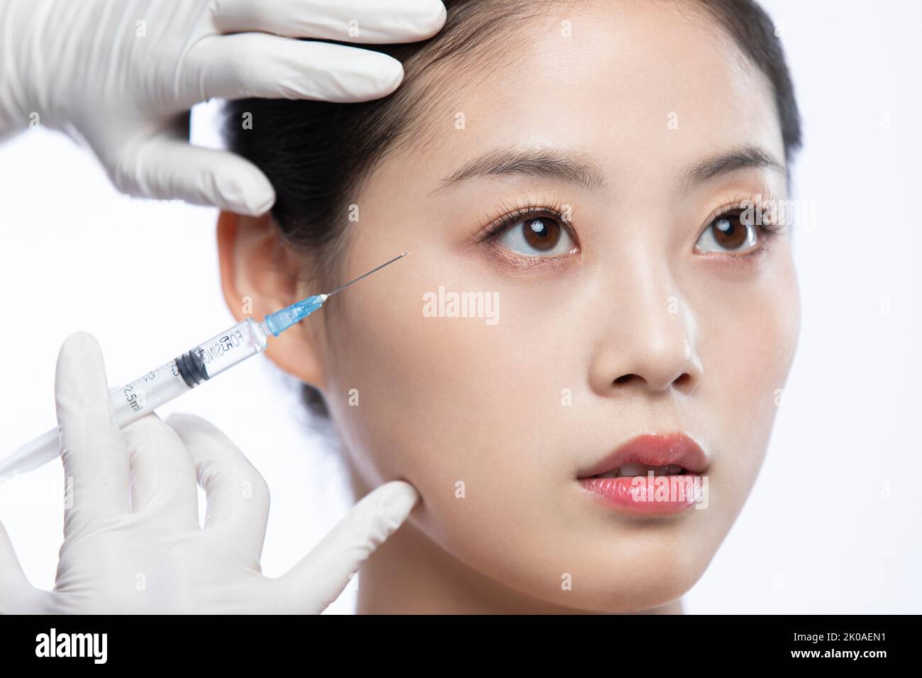 Young Chinese woman receiving Botox treatment Stock Photo - Alamy