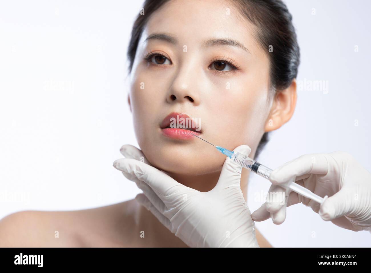 Young Chinese woman receiving Botox treatment Stock Photo - Alamy