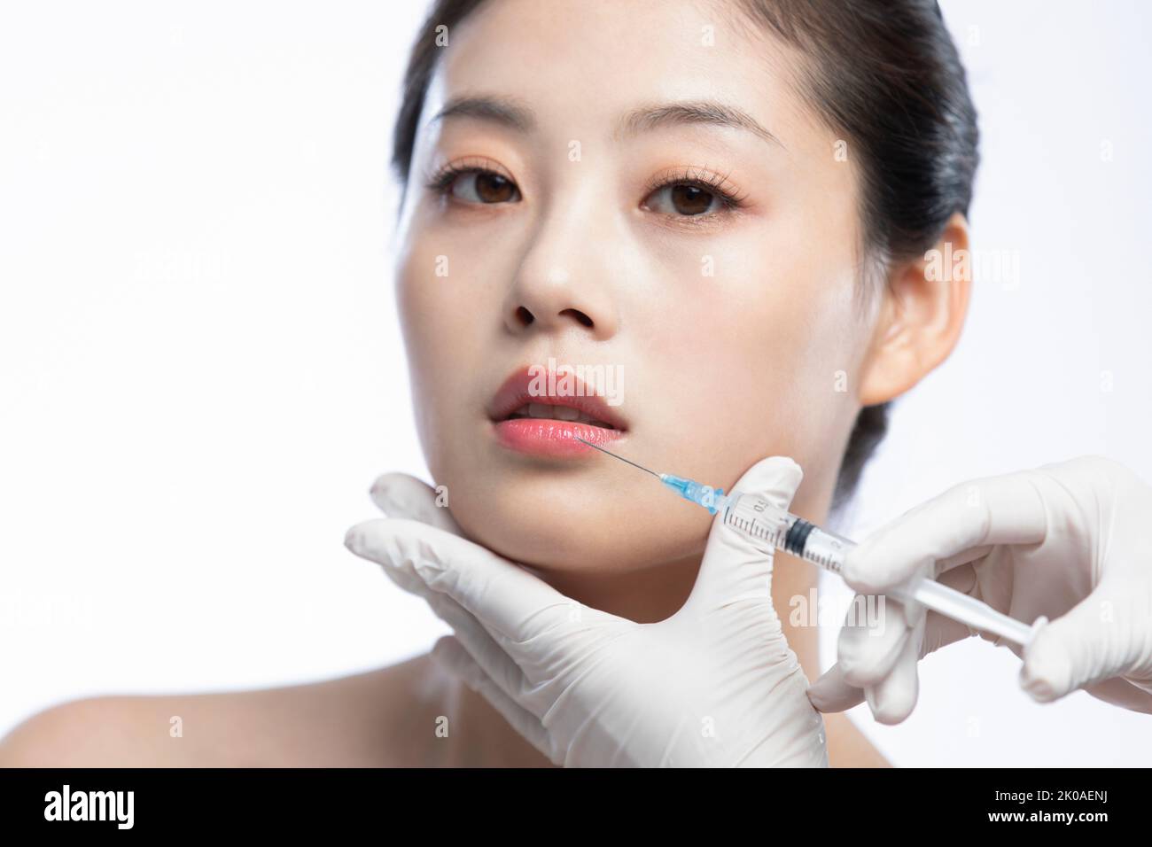 Chinese woman receiving botox injection hi-res stock photography and ...