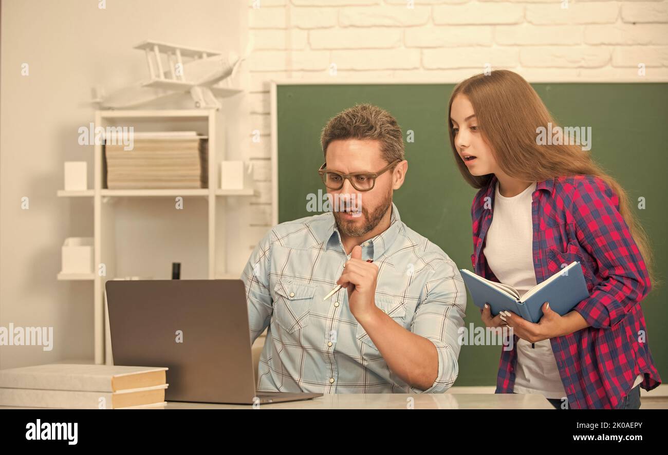 busy student and tutor with laptop. father and teen girl study. private ...