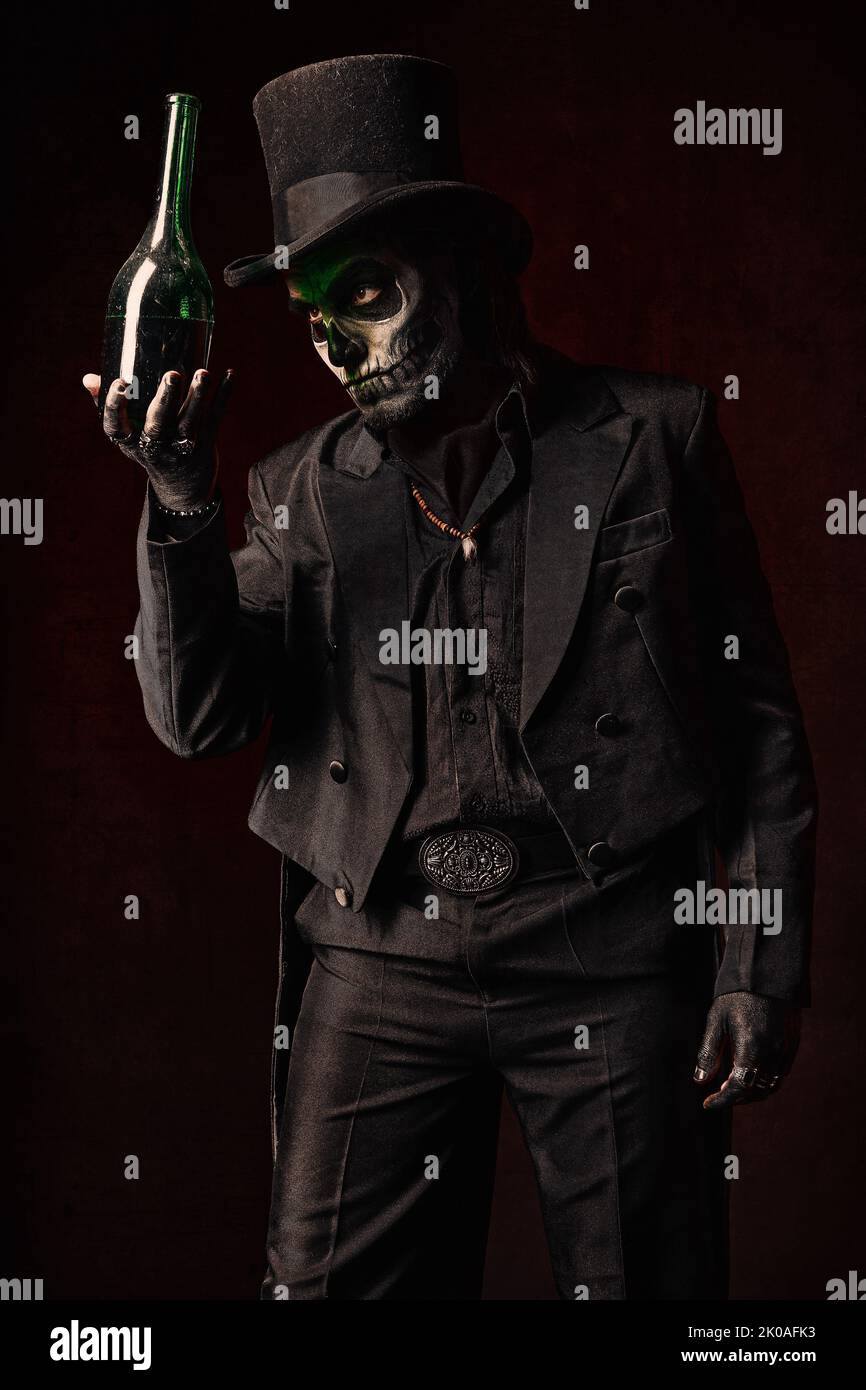 A young man in image of Baron Samedi, the Voodoo deity. Baron Saturday ...