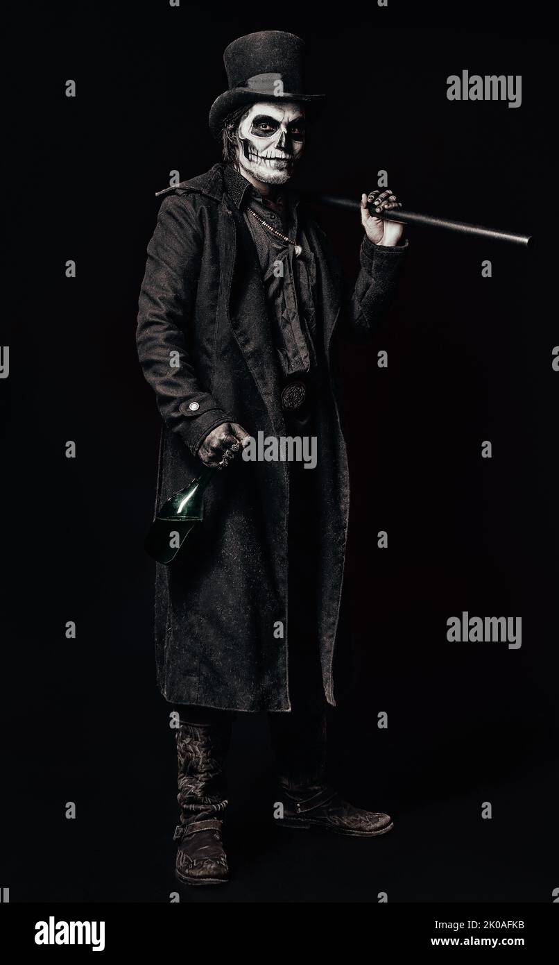 A young man in image of Baron Samedi, the Voodoo deity. Baron Saturday ...