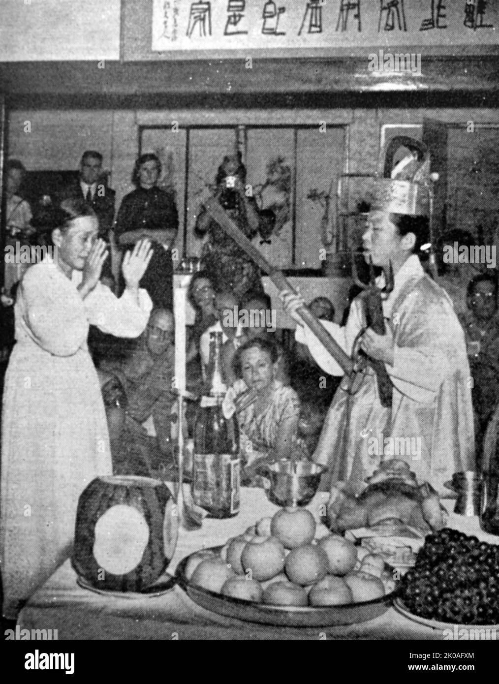 A Korean shaman-priestess exorcising Stock Photo - Alamy