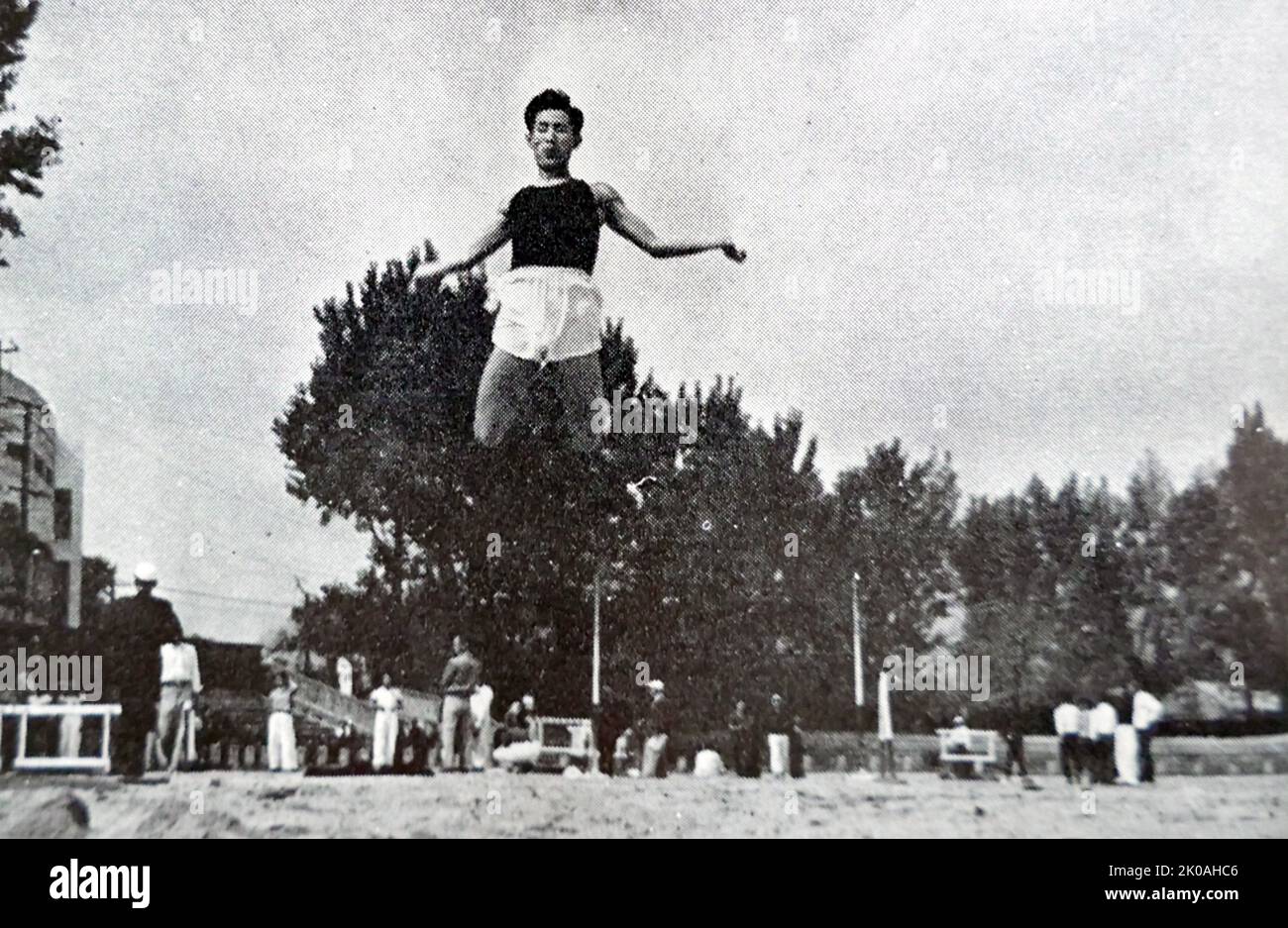A Korean Man performing a Long Jump Stock Photo - Alamy