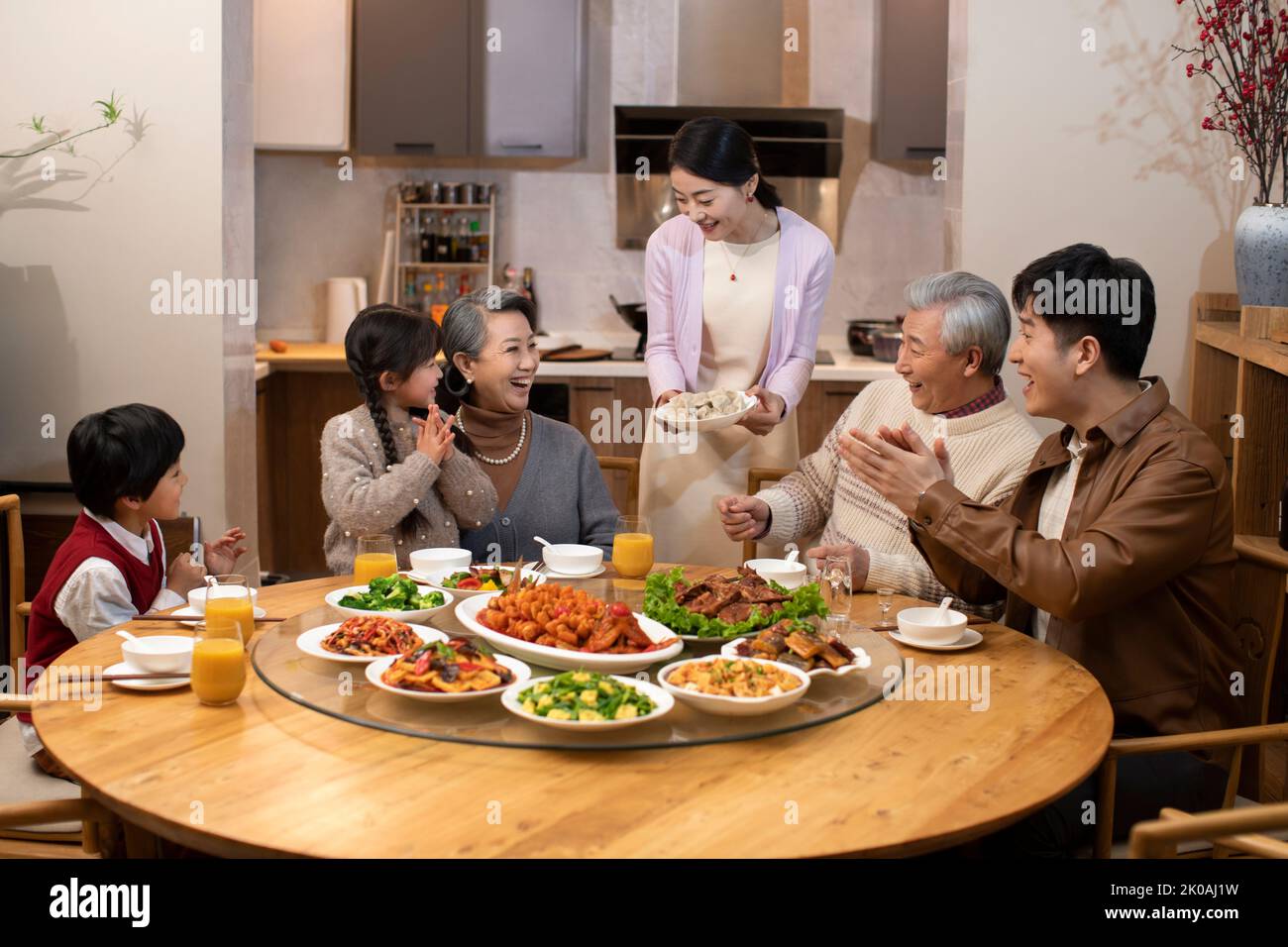 Chinese family eating with chopsticks hi-res stock photography and ...