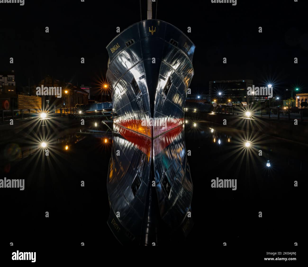 Bow of luxury floating hotel ship Fingal Edinburgh lit up at night in ...