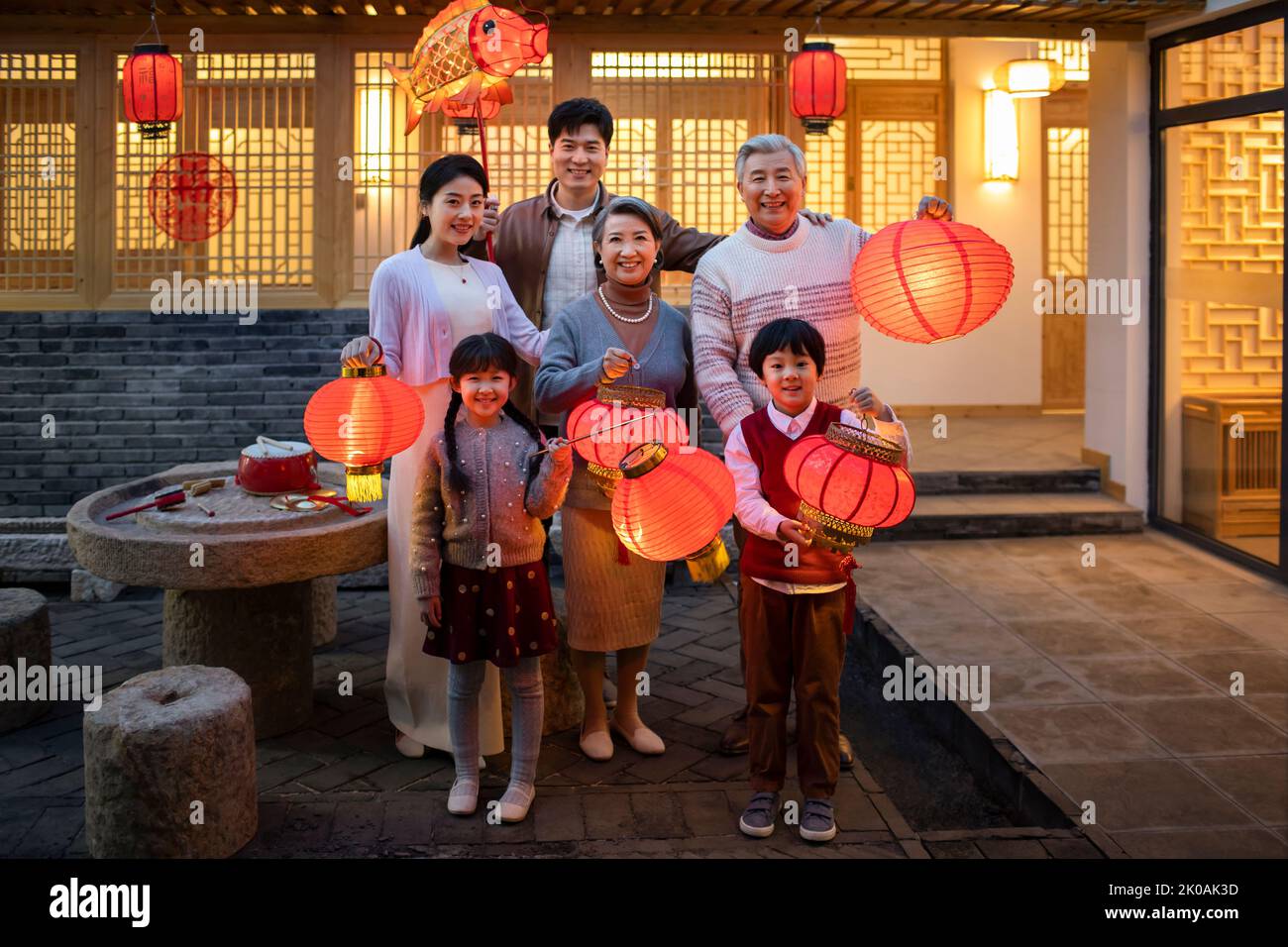 Happy family celebrating Chinese New Year Stock Photo - Alamy