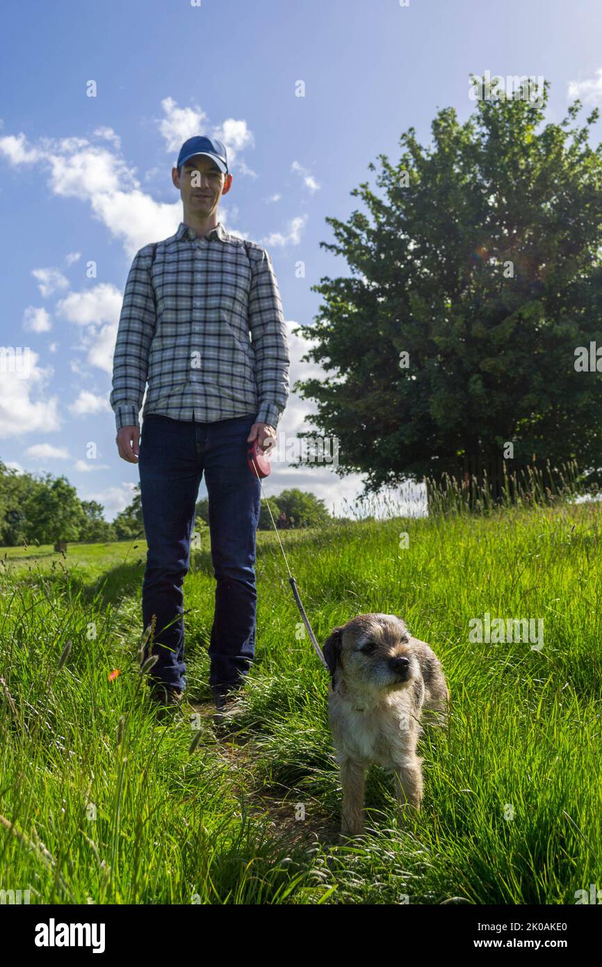 Man walking small brown hi-res stock photography and images - Alamy