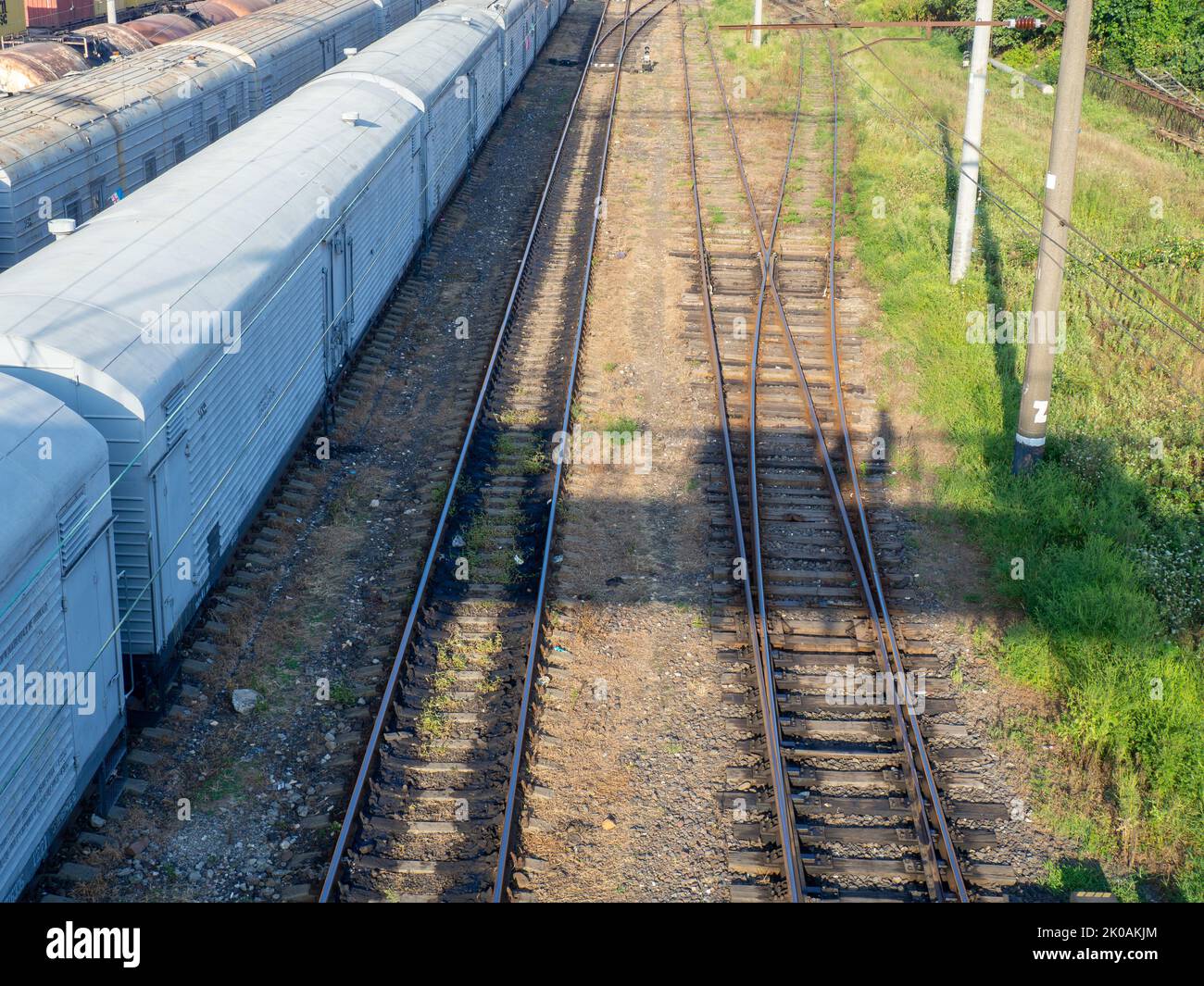 Railroad in the city. Many railway paths. Wagons and trains on the tracks. unloading station ...