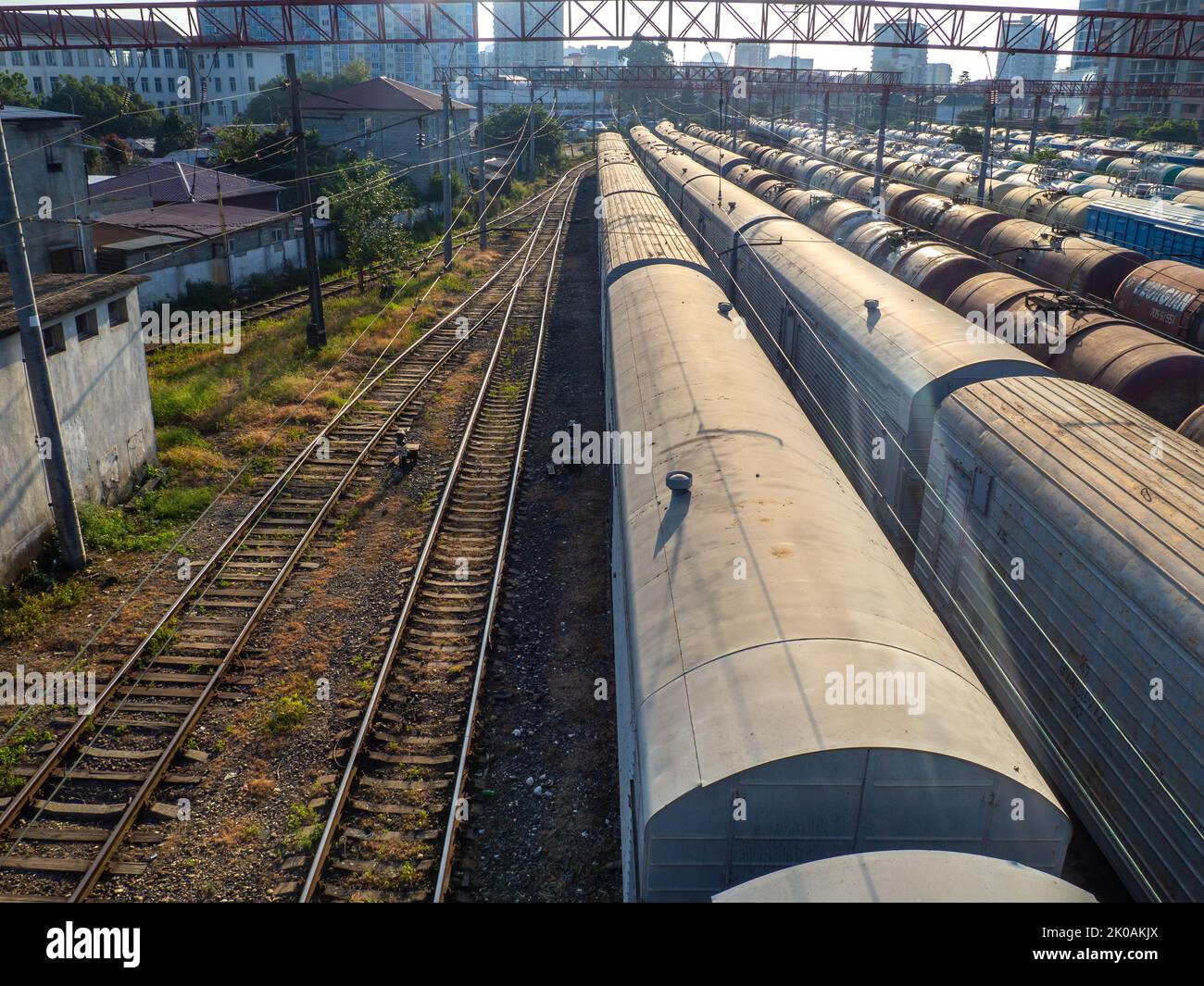 Railroad in the city. Many railway paths. Wagons and trains on the tracks. unloading station ...