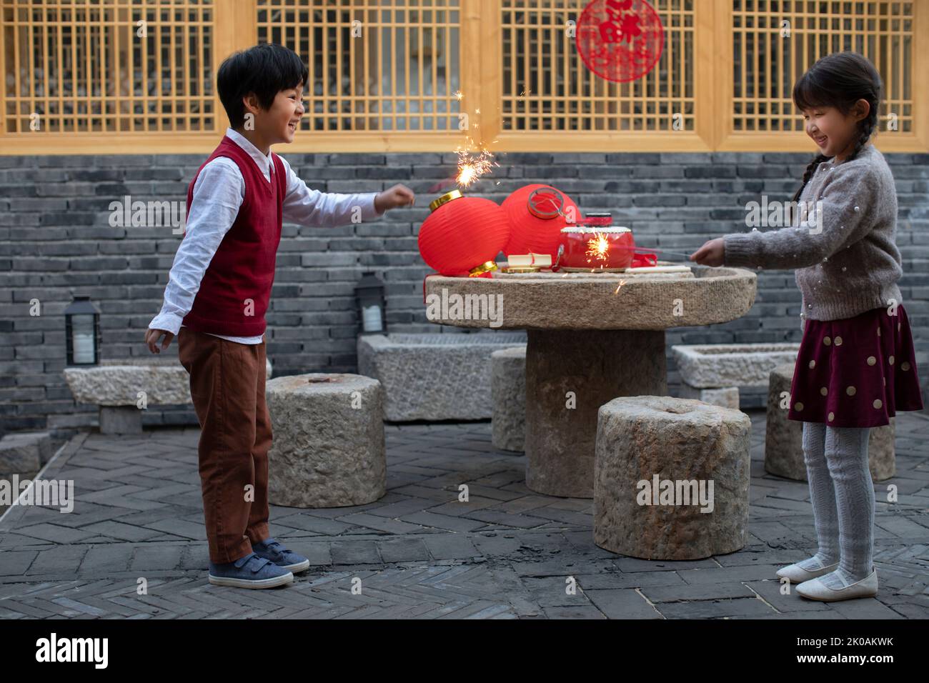 Happy children celebrating Chinese new year Stock Photo - Alamy