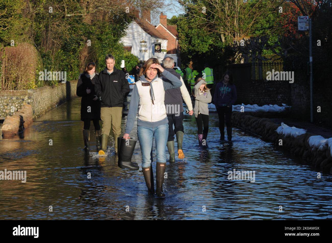Residents wade in flood in hi-res stock photography and images - Alamy