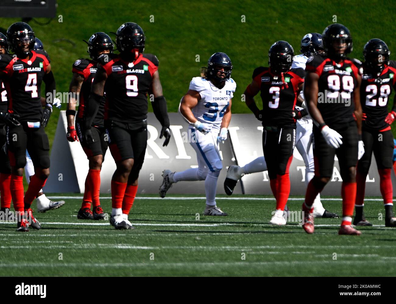 Toronto Argonauts running back AJ Ouellette (34) runs past the Ottawa ...
