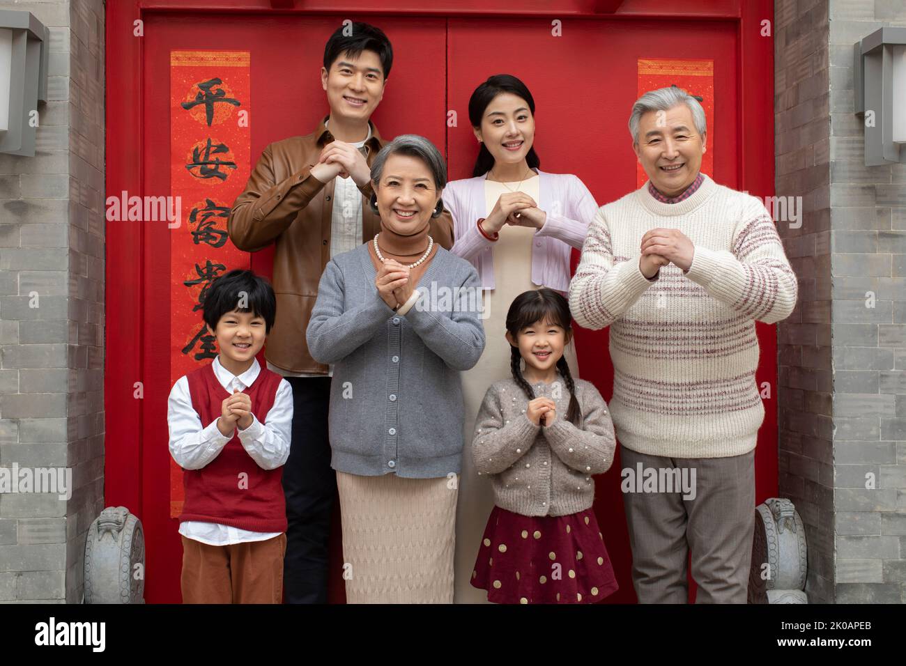 Happy family celebrating Chinese New Year Stock Photo - Alamy