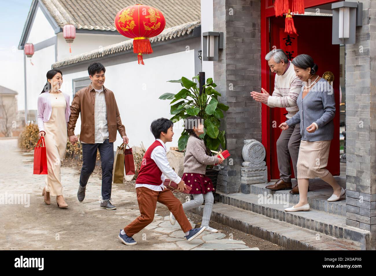 Happy family celebrating Chinese New Year Stock Photo - Alamy