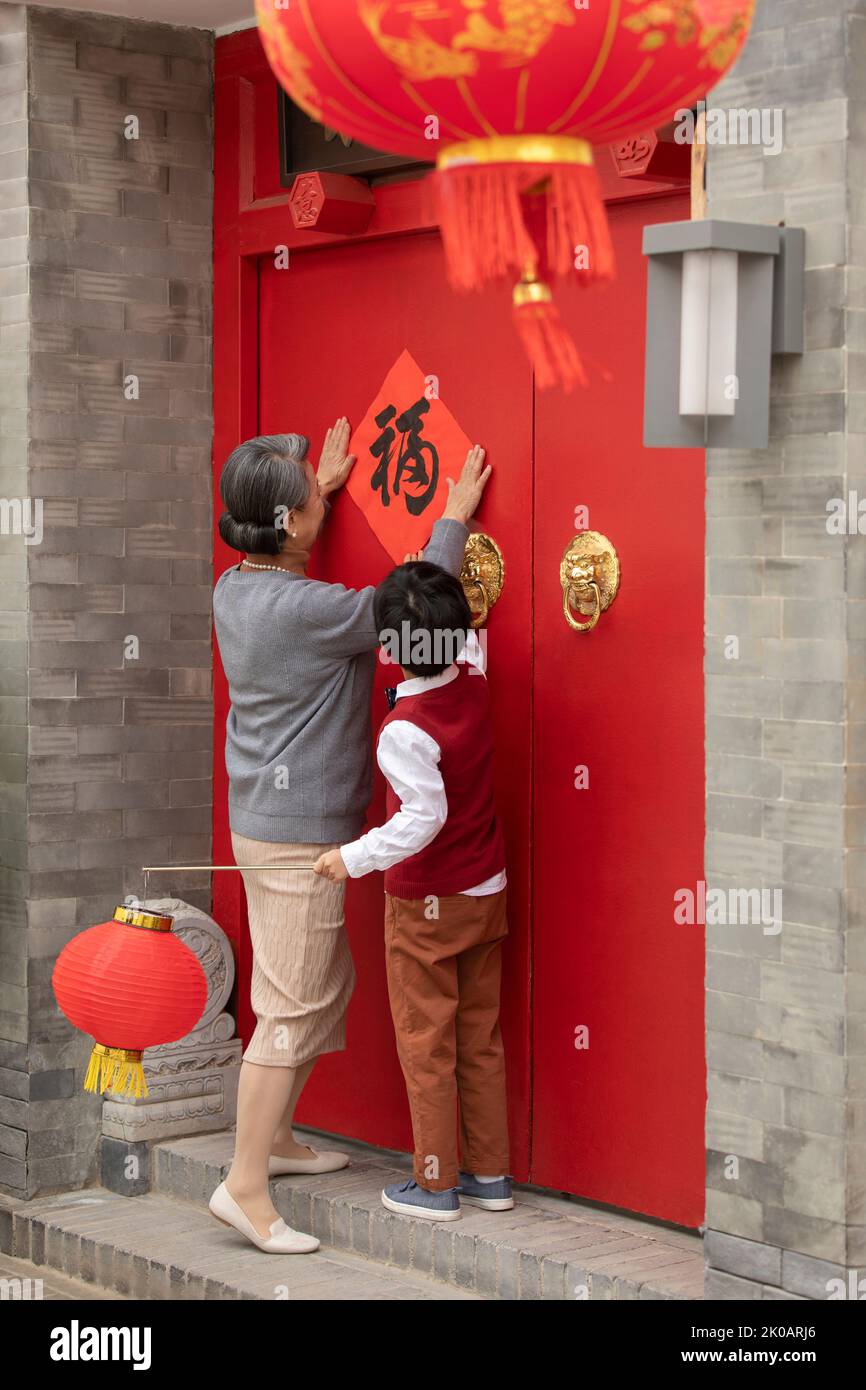Happy grandmother and grandson celebrating Chinese New Year Stock Photo ...