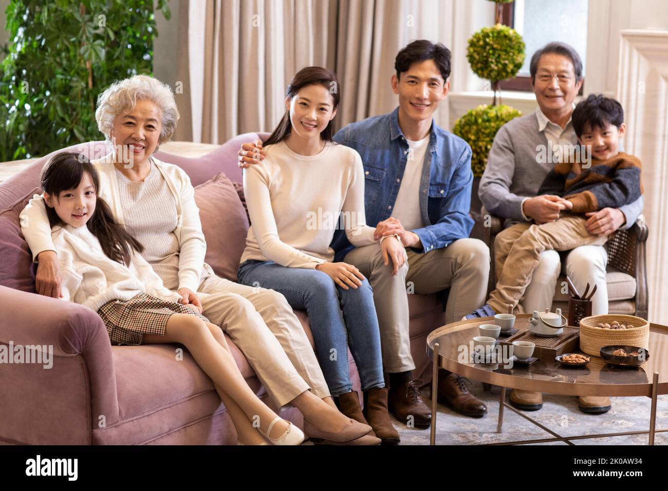 Happy Chinese family spending time together Stock Photo - Alamy