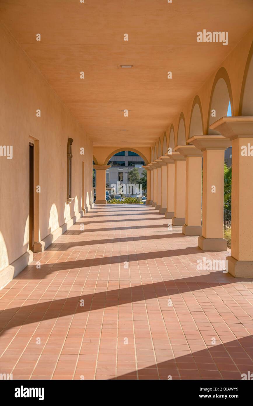 Arch passageway with arch pillars and red tiles at downtown Tucson ...