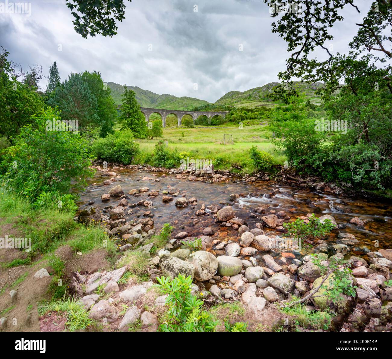World famous bridge,framed by green trees,and narrow river,in the West ...
