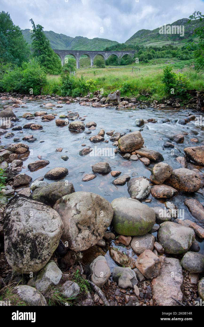 World famous bridge,framed by green trees,and narrow river,in the West ...