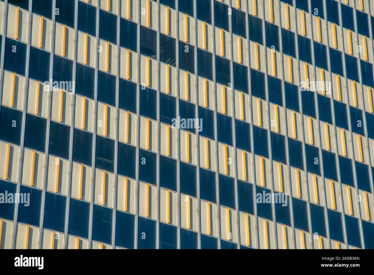 Modern building with yellow lines in between the window walls at ...