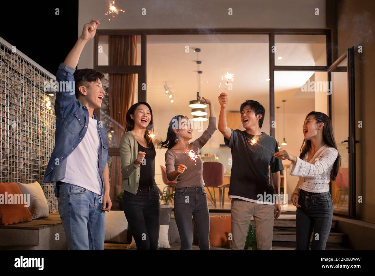 Happy Chinese friends having fun together Stock Photo - Alamy