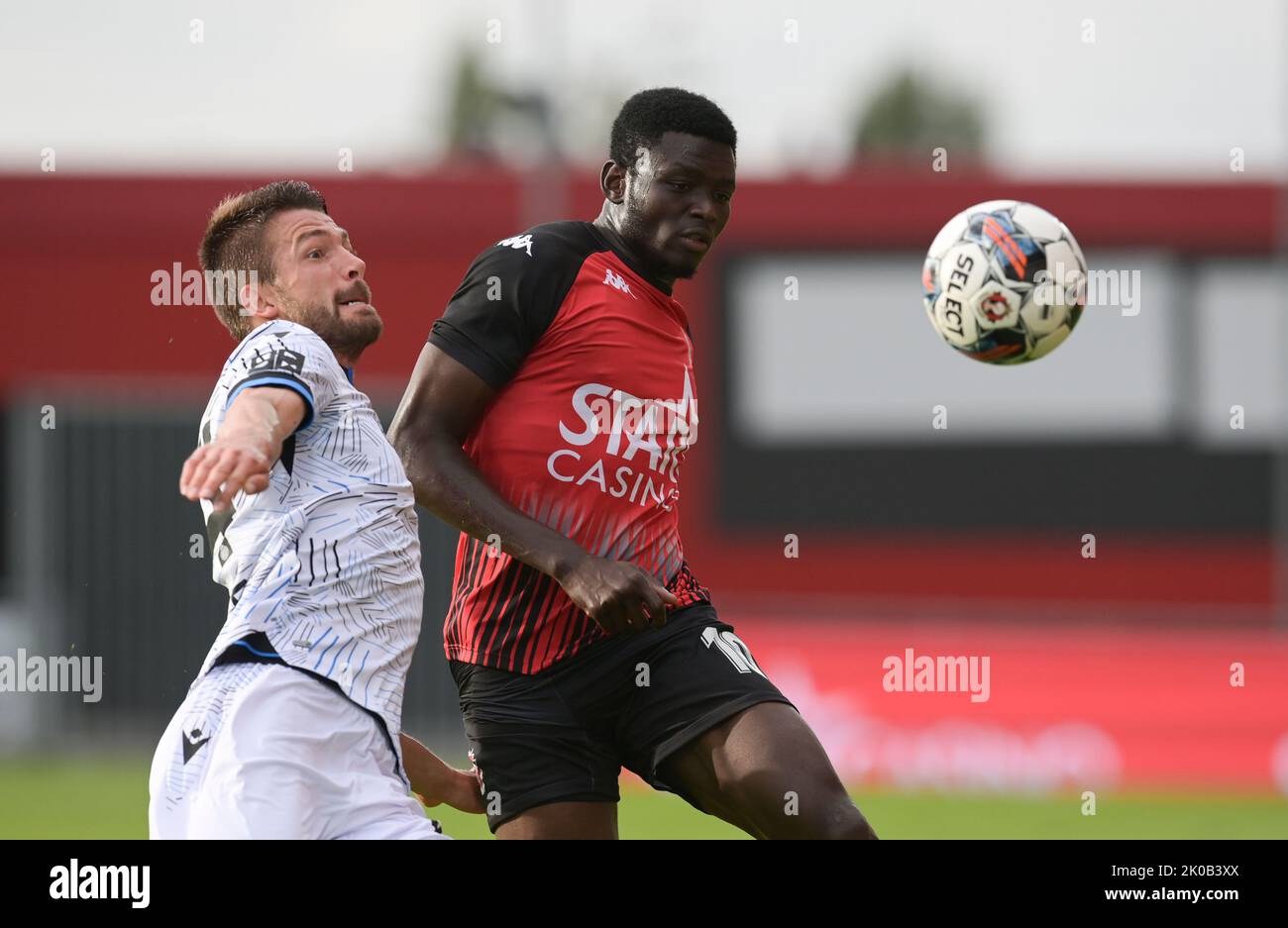 Club's Brandon Mechele and Seraing's Marius Mouandilmadji fight for the ball during a soccer ...
