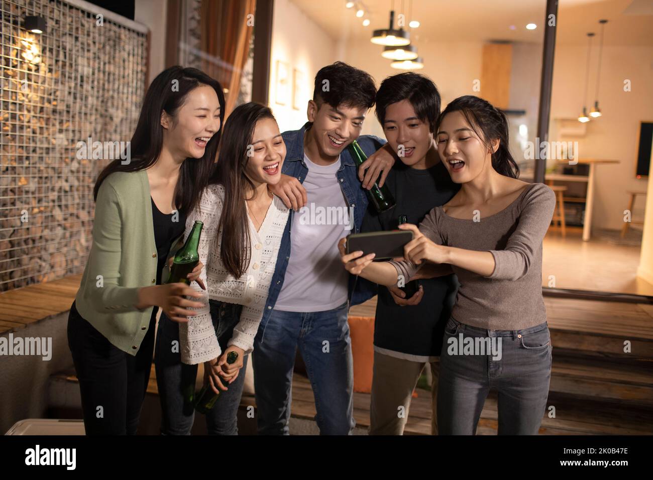 Happy Chinese friends having fun together Stock Photo - Alamy