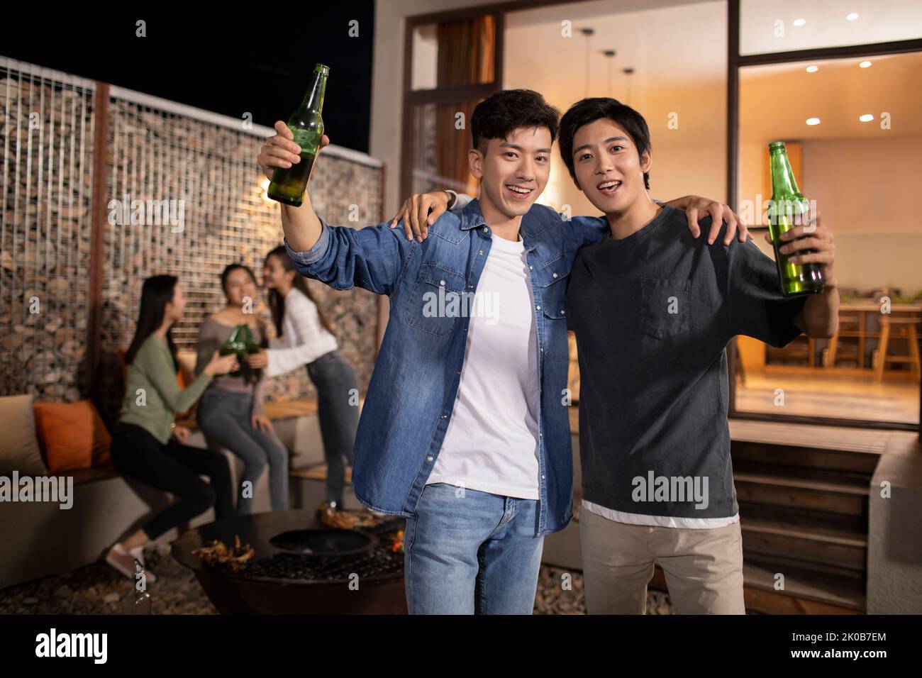 Happy young chinese friends barbecuing hi-res stock photography and ...