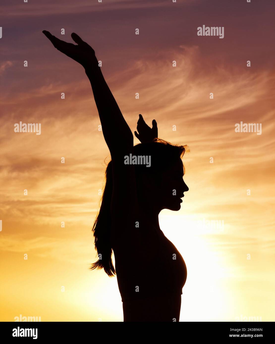 Freedom - Woman with arms raised at sunset. Freedom - Silhouette image ...