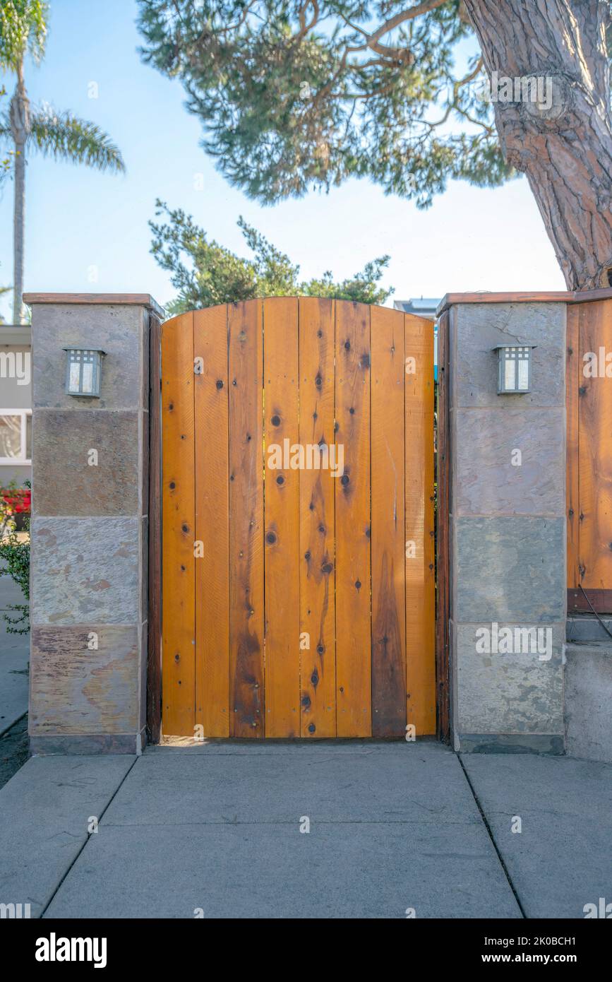 La Jolla, California- Wooden single gate entrance in between the tiled ...