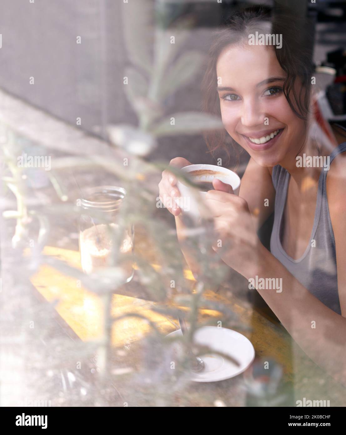 This is my spot. a young woman drinking coffee at a cafe Stock Photo ...