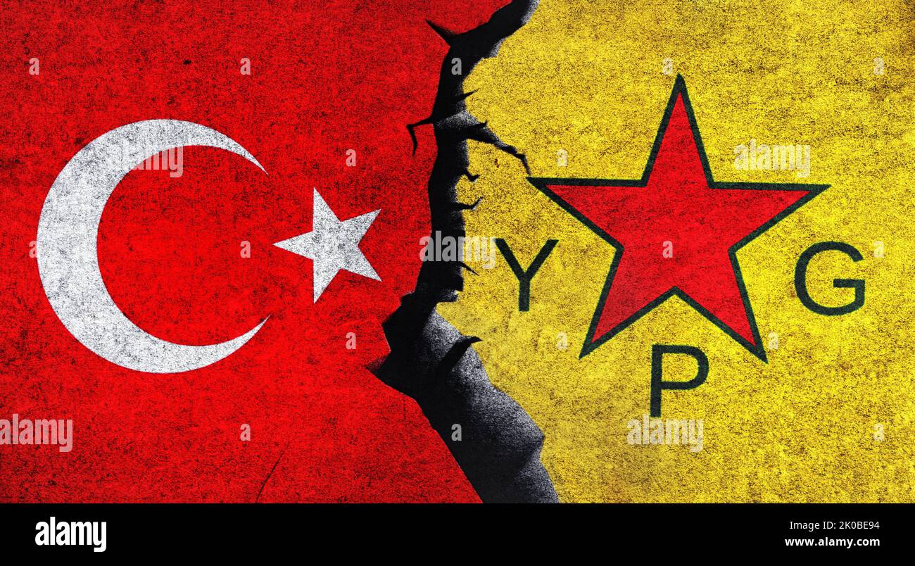 Turkey and Kurdish militants flags on a wall with a crack. Kurdish and ...