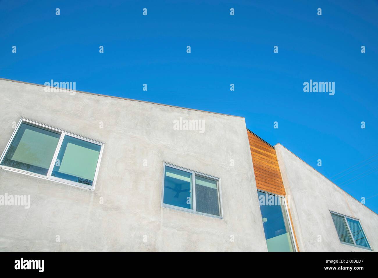 La Jolla, California- Building with off-white and wood cladding wall ...