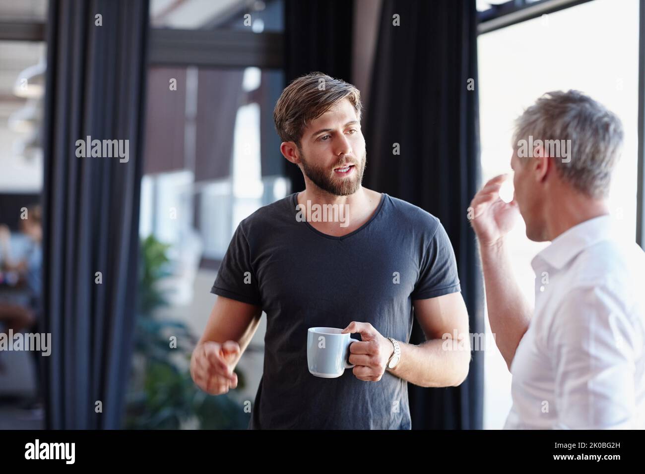 Businessmen in deep discussion hi-res stock photography and images - Alamy