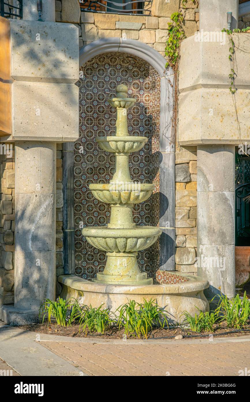La Jolla, California- Water fountain outside a building with plants at ...