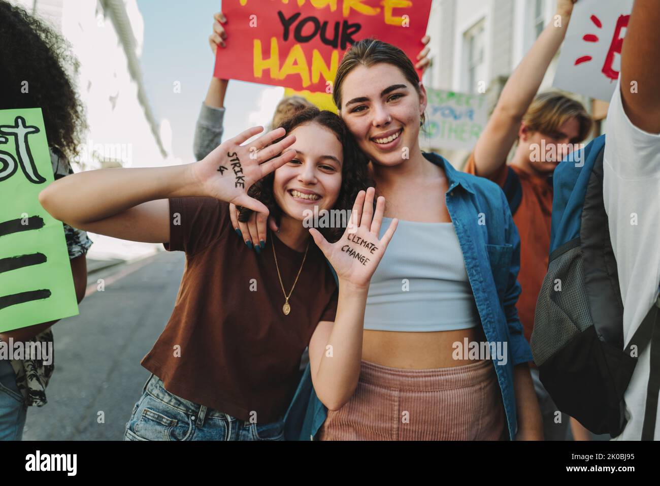 Global strike for climate change. Happy teenage girls smiling at the ...