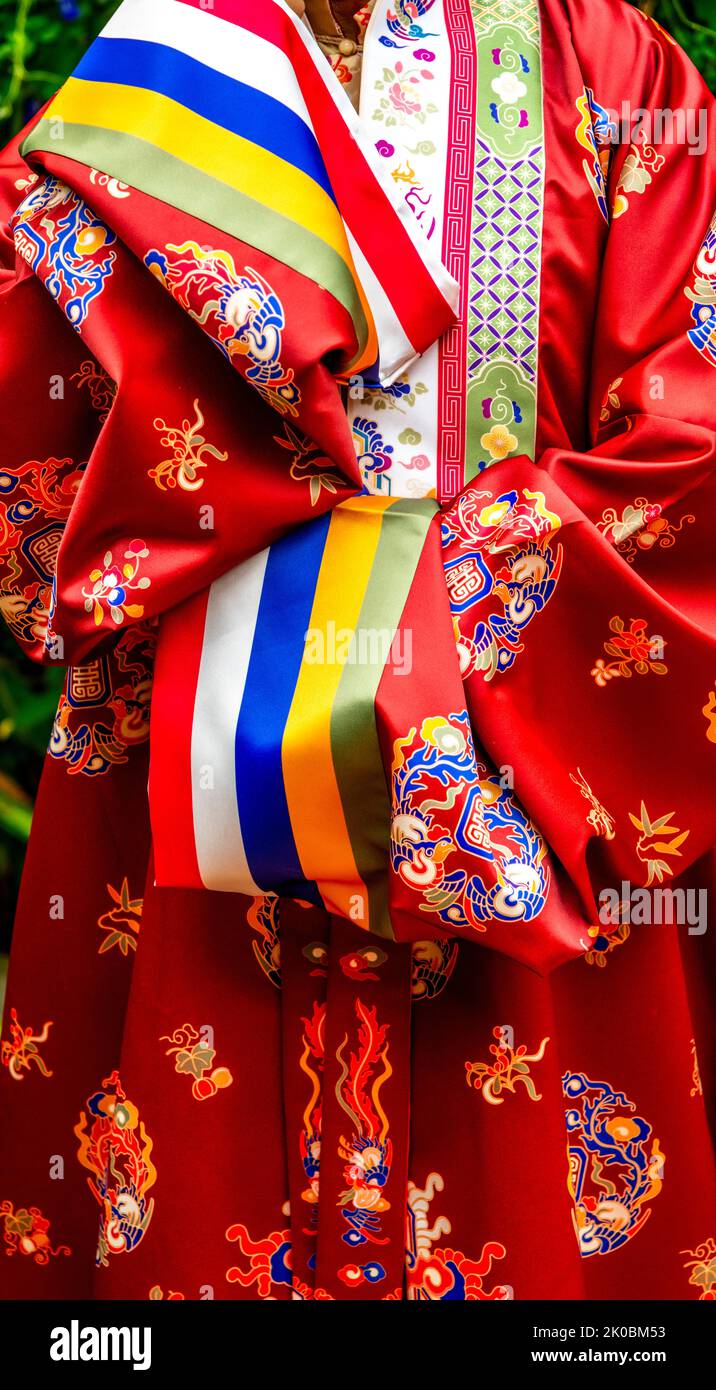 Red Royal Gown with color stripes Stock Photo - Alamy